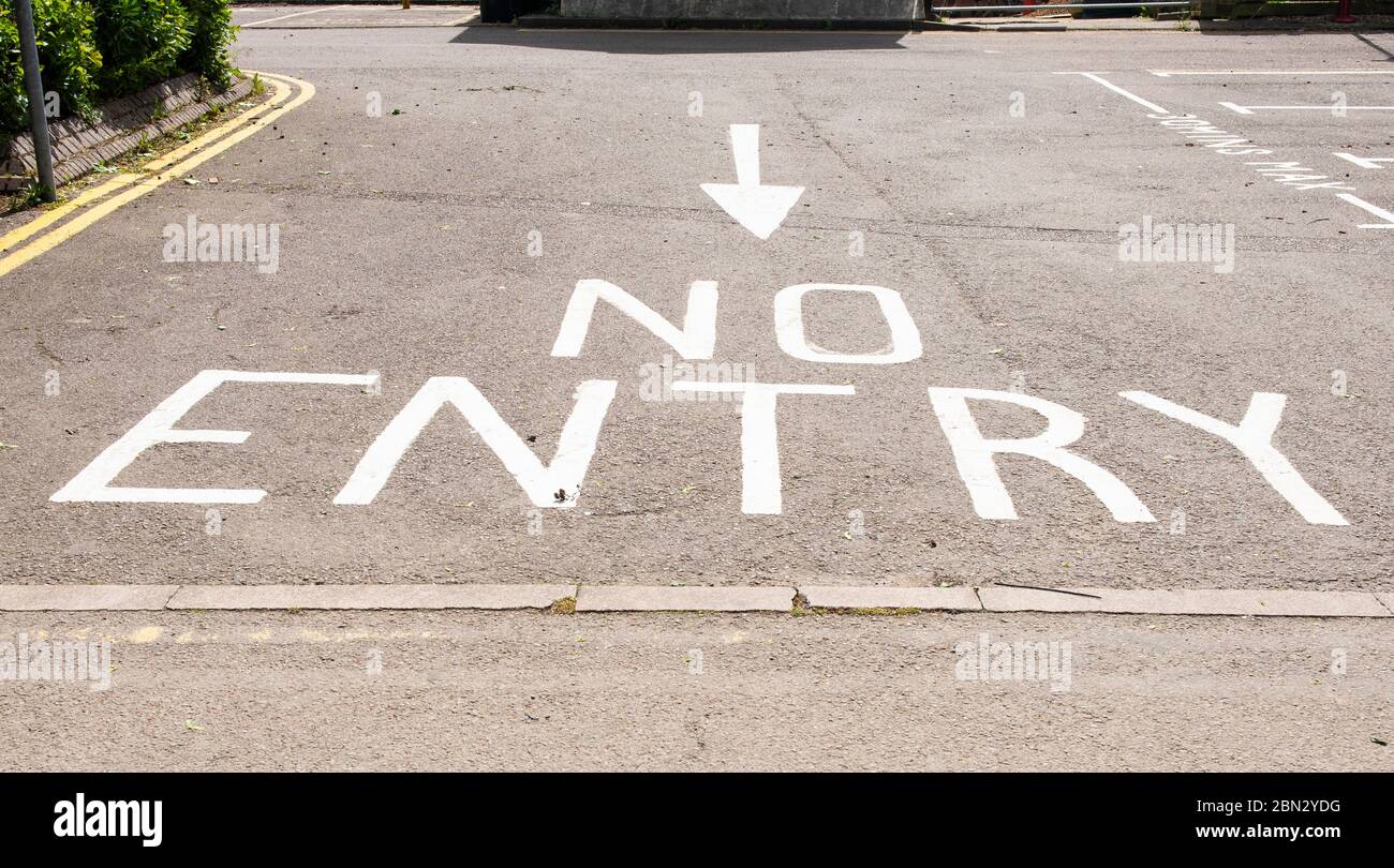 No Entry in white paint on road with an arrow pointing towards viewer ...