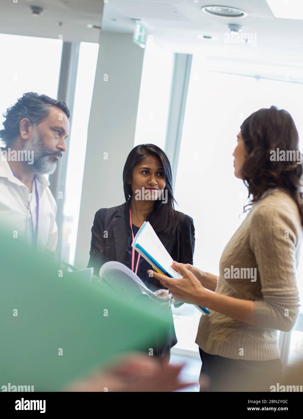 Business people talking in office Stock Photo - Alamy