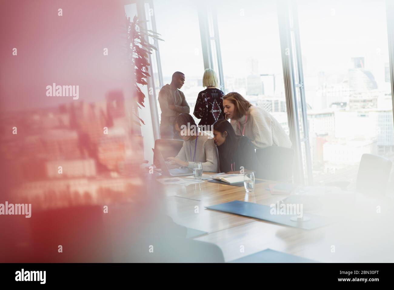 Business people at laptop in conference room meeting Stock Photo - Alamy