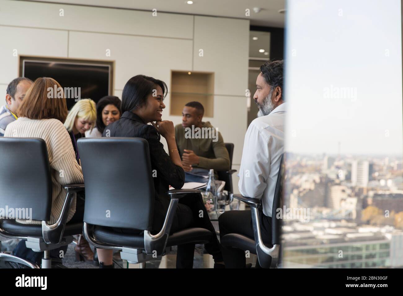 Business people talking in conference room meeting Stock Photo - Alamy