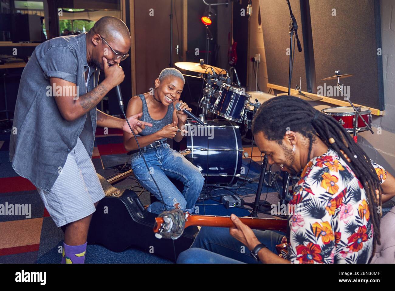 Musicians practicing in recording studio Stock Photo - Alamy