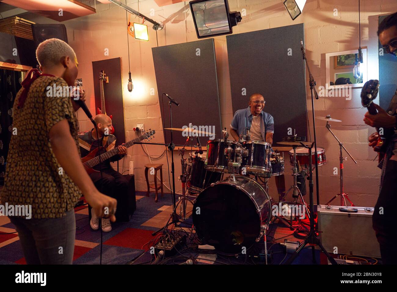 Musicians practicing in recording studio Stock Photo - Alamy