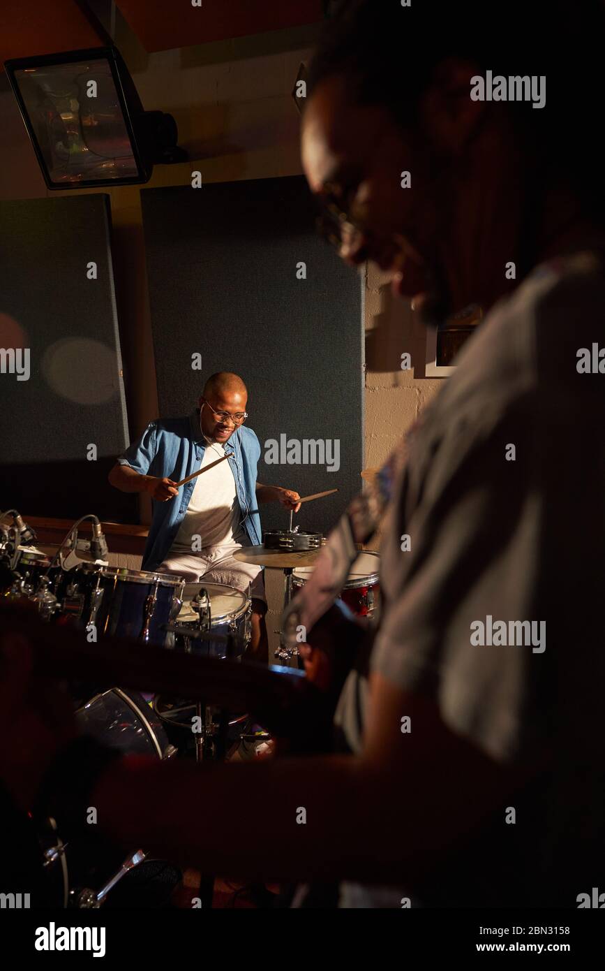 Musicians practicing in recording studio Stock Photo - Alamy