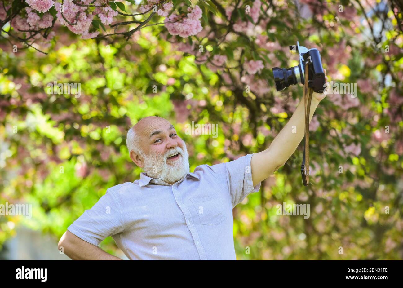 Self portrait. Memories in snap. Everyone photogenic. Senior man taking ...