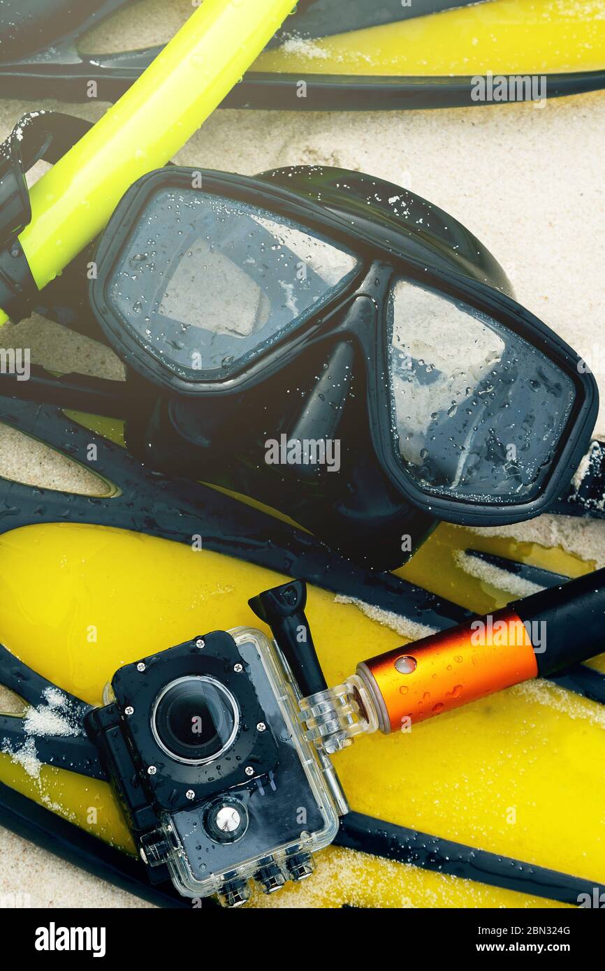 Equipment for snorkeling and action camera in waterproof case on the ...