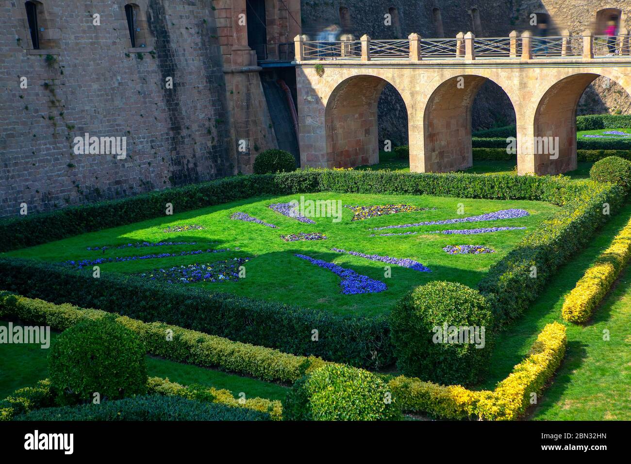 designed garden of medieval castle and architectural arches Stock Photo ...