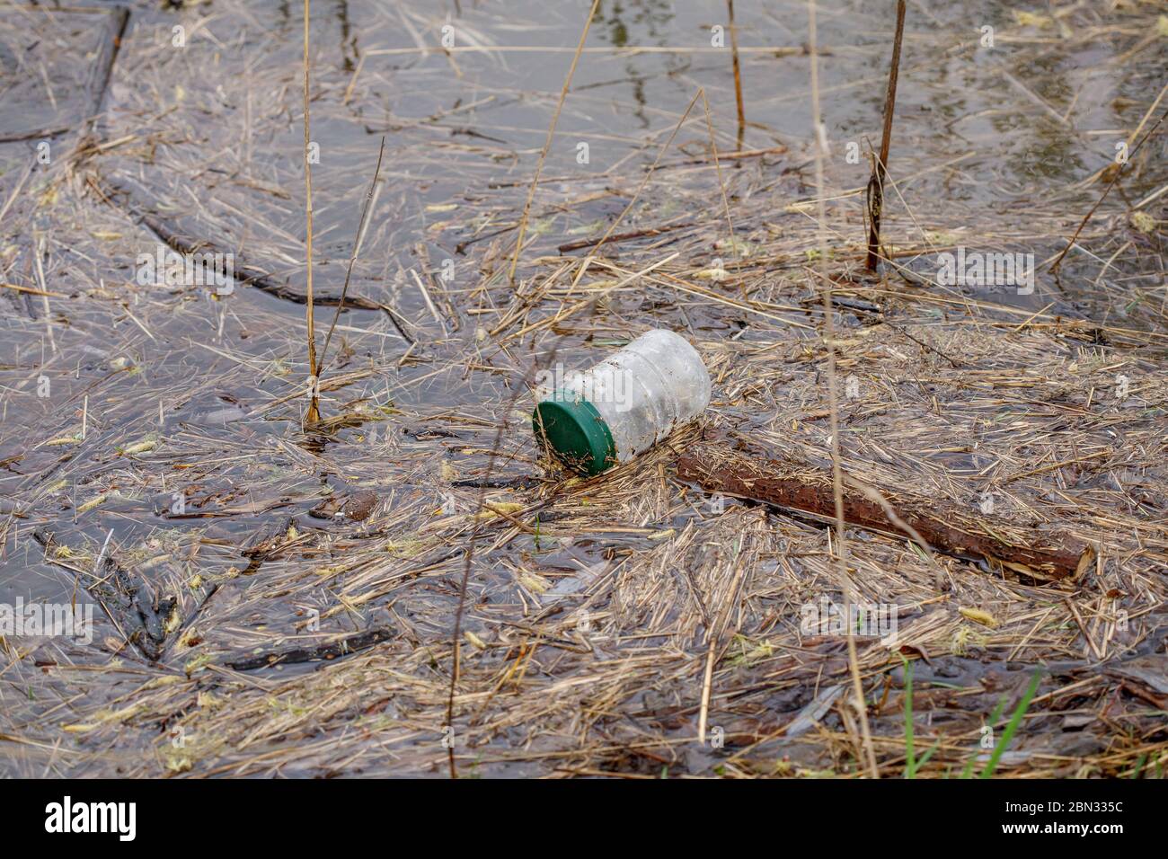 Plastic and bottle in river, garbage pollution concept Stock Photo - Alamy