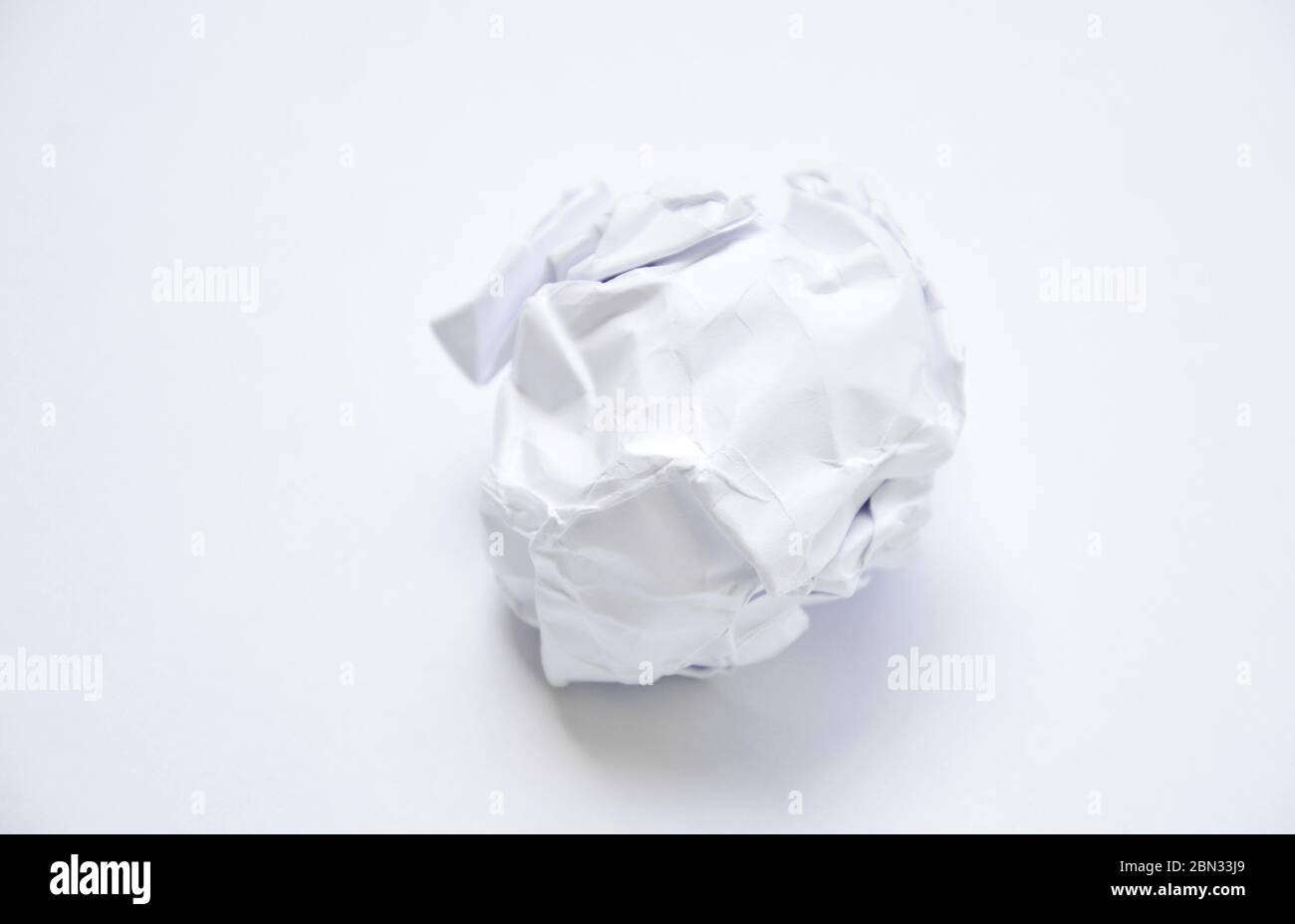 Crumpled white paper roll texture on a white background Stock Photo - Alamy