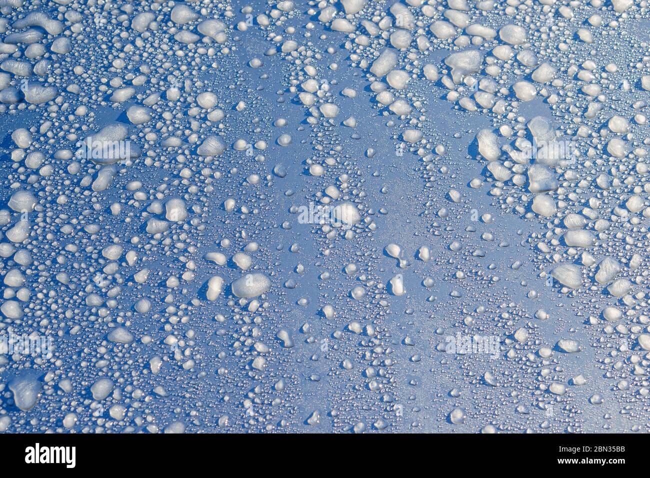 Frozen water drops on metal surface Stock Photo - Alamy