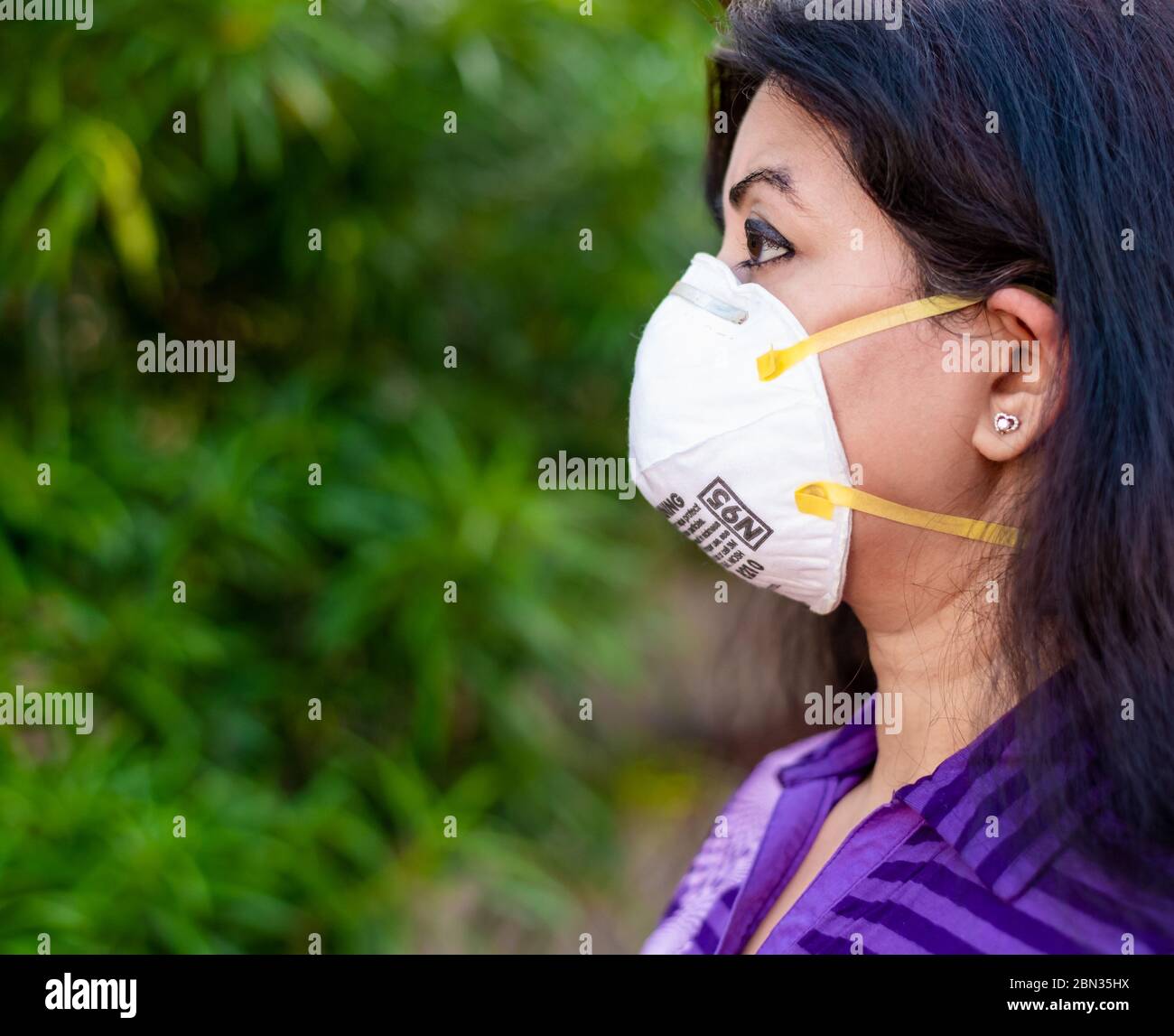 An Indian Lady using N95 Mask to protect herself at the time of ...