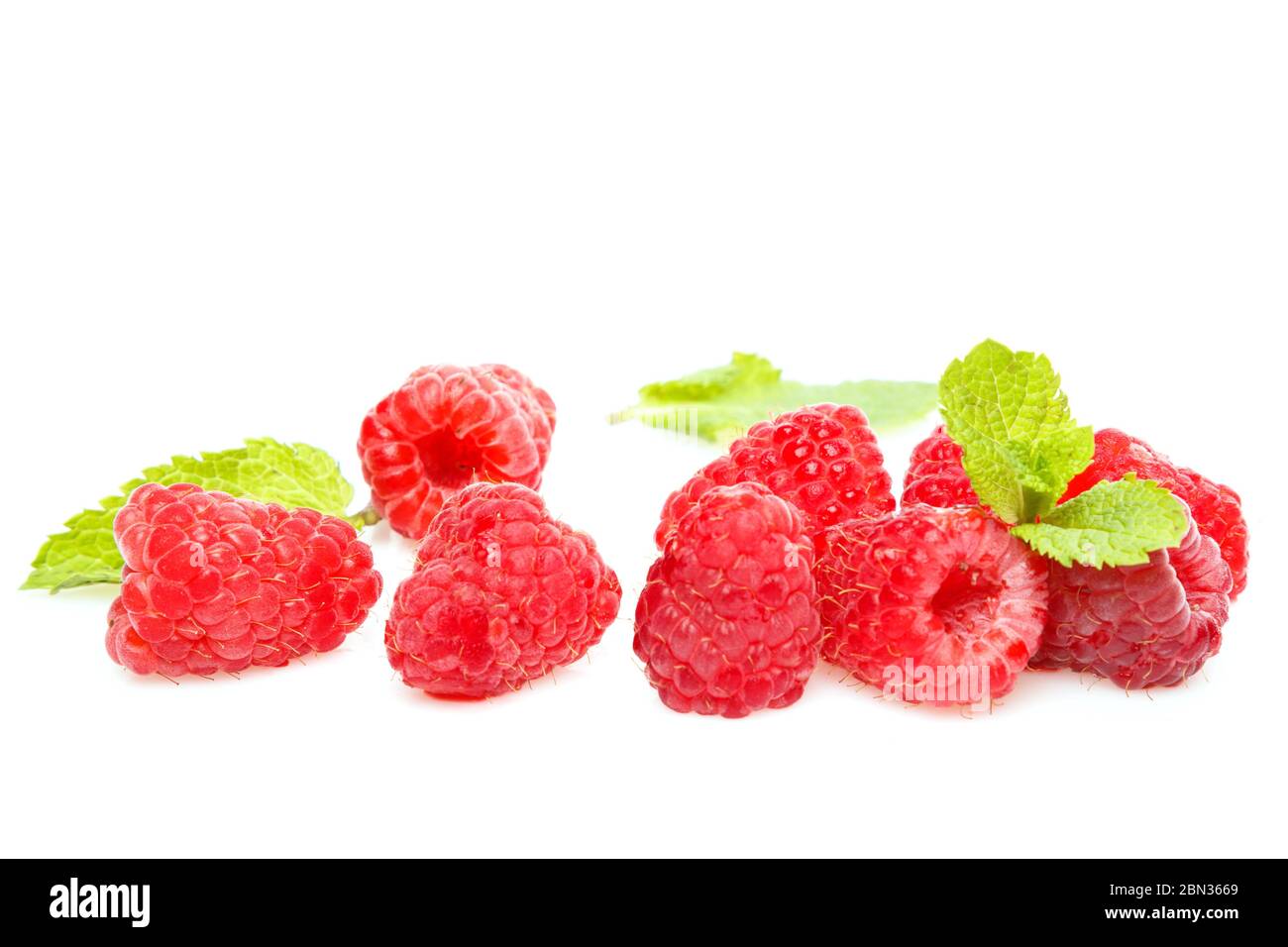 Fresh raspberries on white background Stock Photo - Alamy