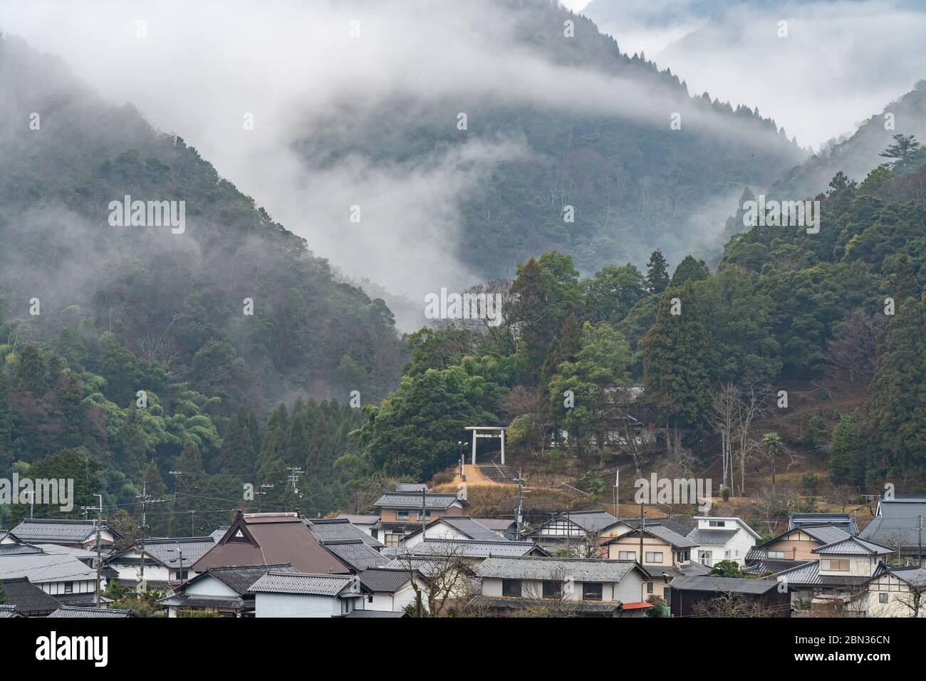 View of mountains and rural scene in foggy weather, Japanese country ...