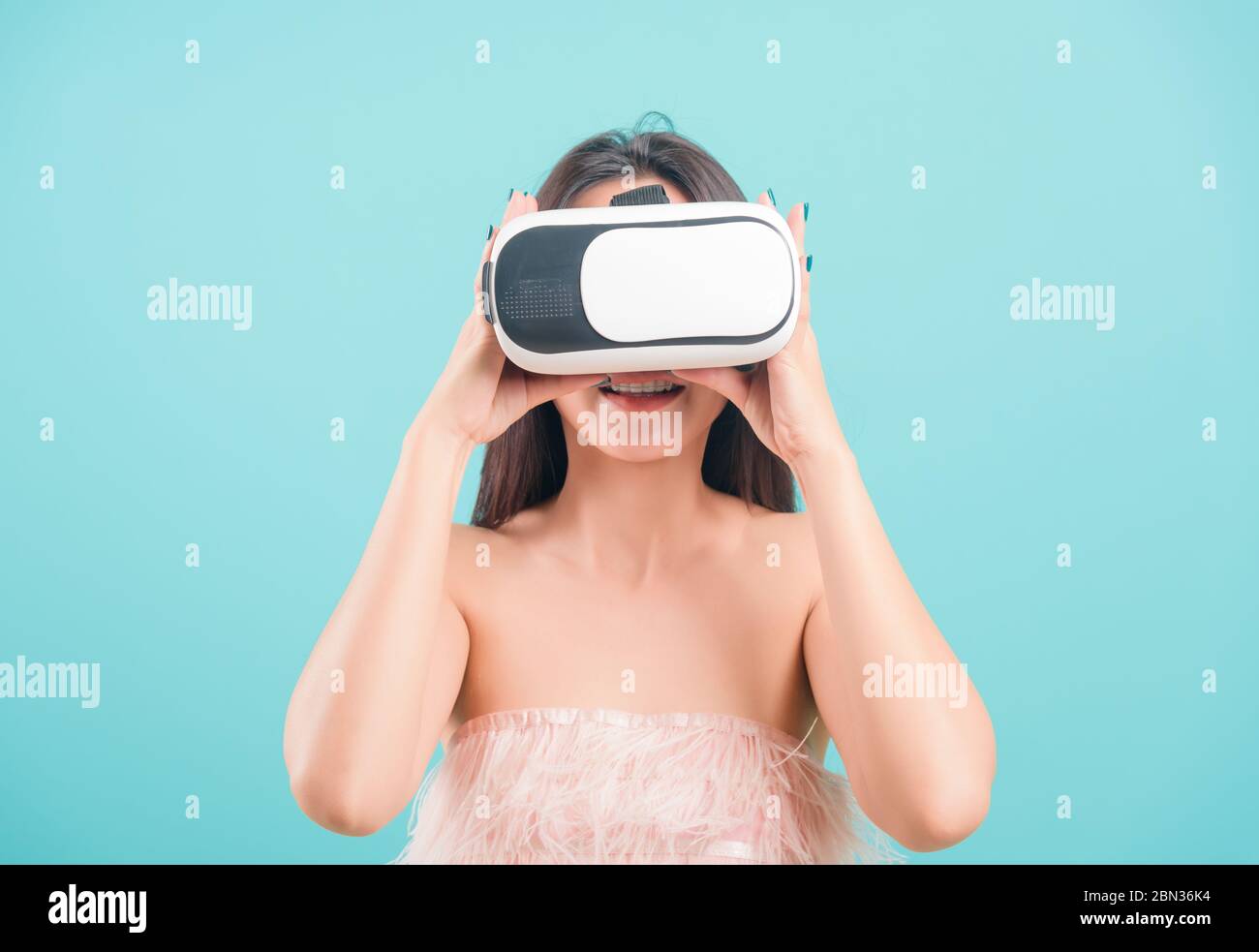 Asian happy portrait beautiful young woman standing smile her using a ...