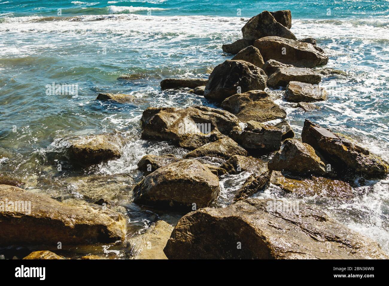 Beautiful seascape with blue water and rocks Stock Photo - Alamy
