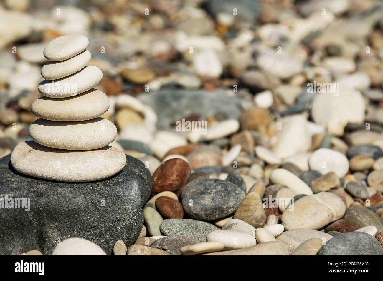 Stack of smooth round stones on the pebble beach Stock Photo - Alamy
