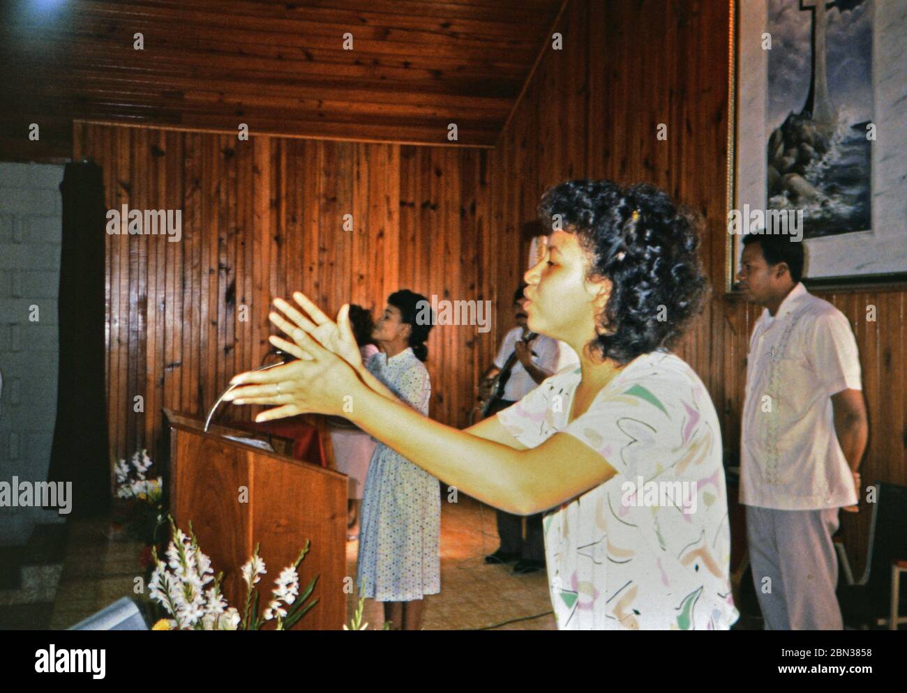 Woman clapping hands in worship hi-res stock photography and images - Alamy