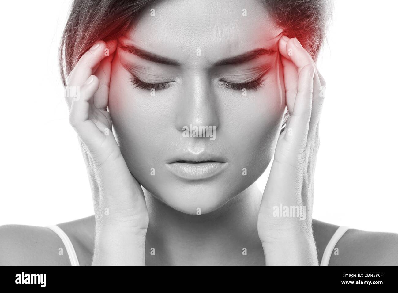 Woman with a headache on white background Stock Photo - Alamy