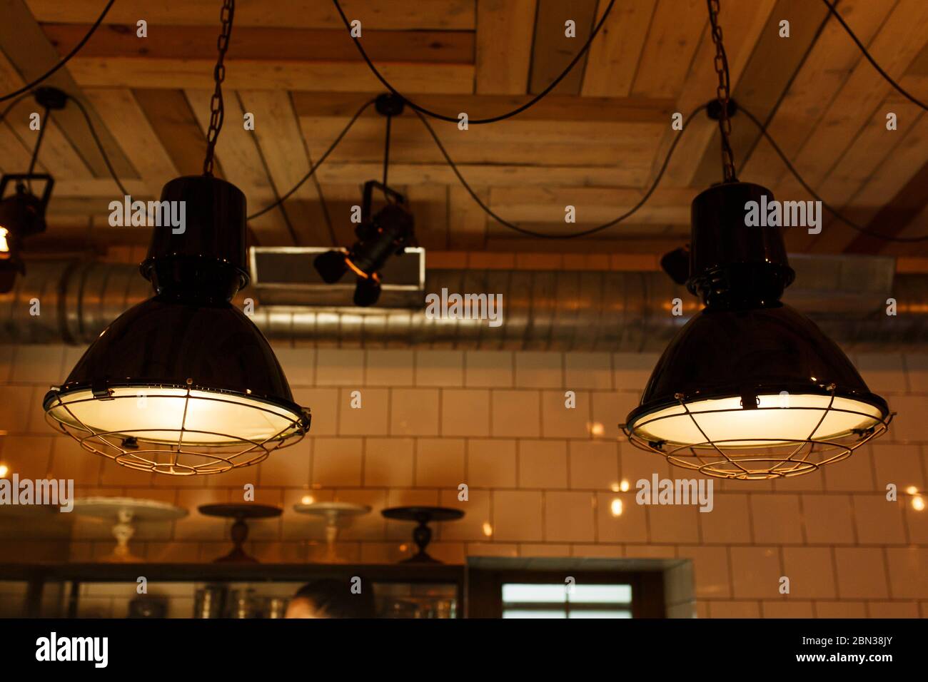 Stylish lighting lamps over a bar counter in a loft hookah bar Stock ...