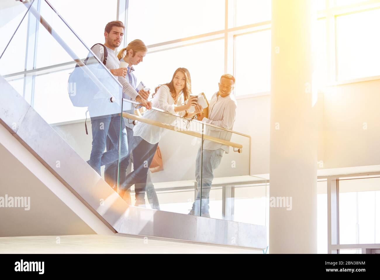 Group stands building hi-res stock photography and images - Alamy