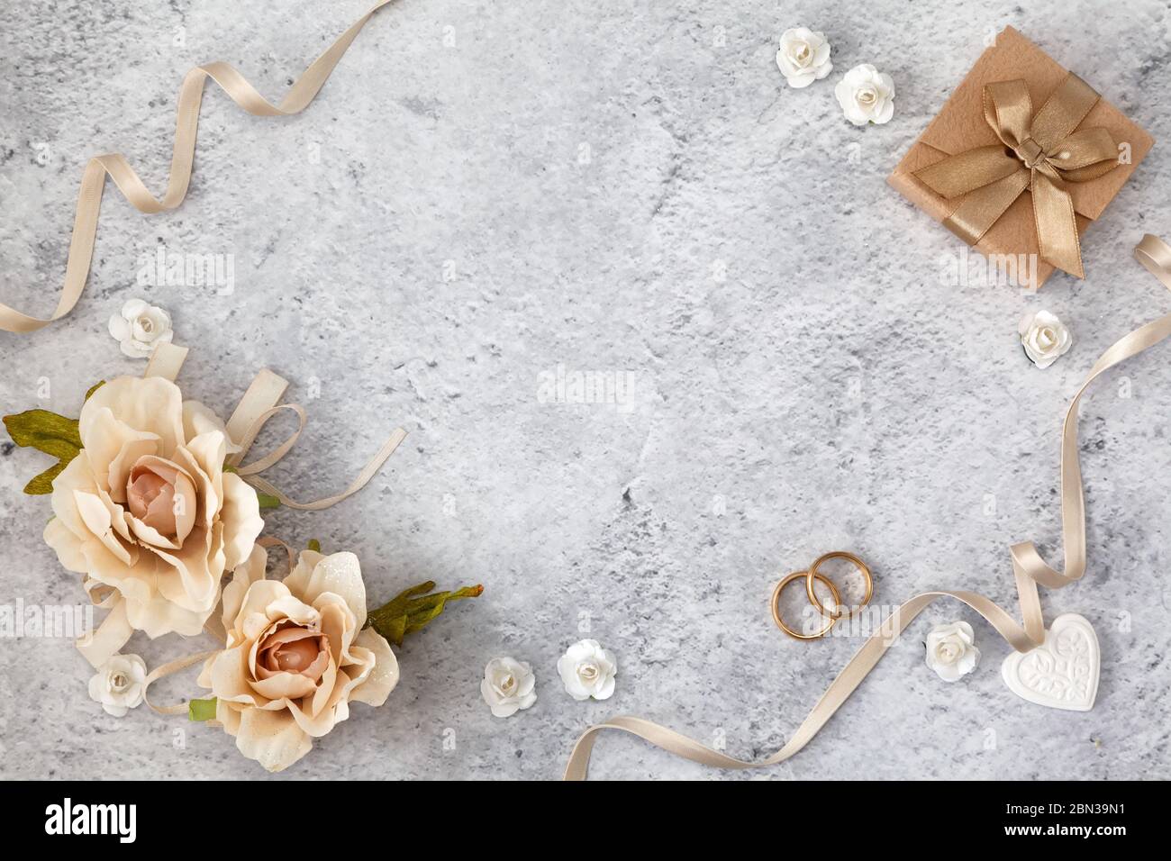 Wedding decoration with rings laying on table Stock Photo - Alamy
