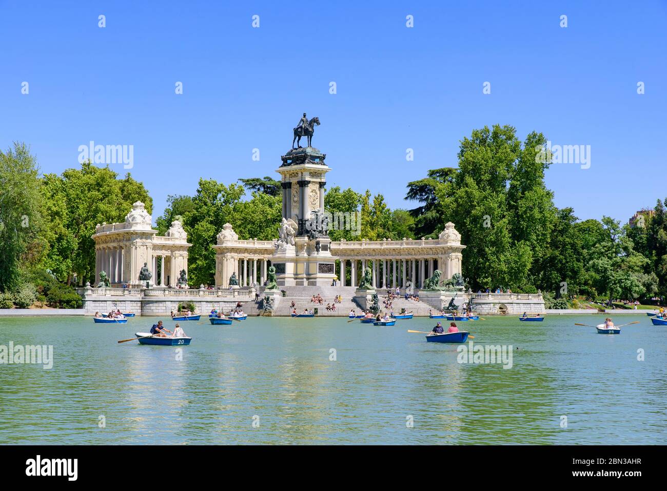 People rowing boats on the Retiro Park Lake in Madrid, Spain Stock ...