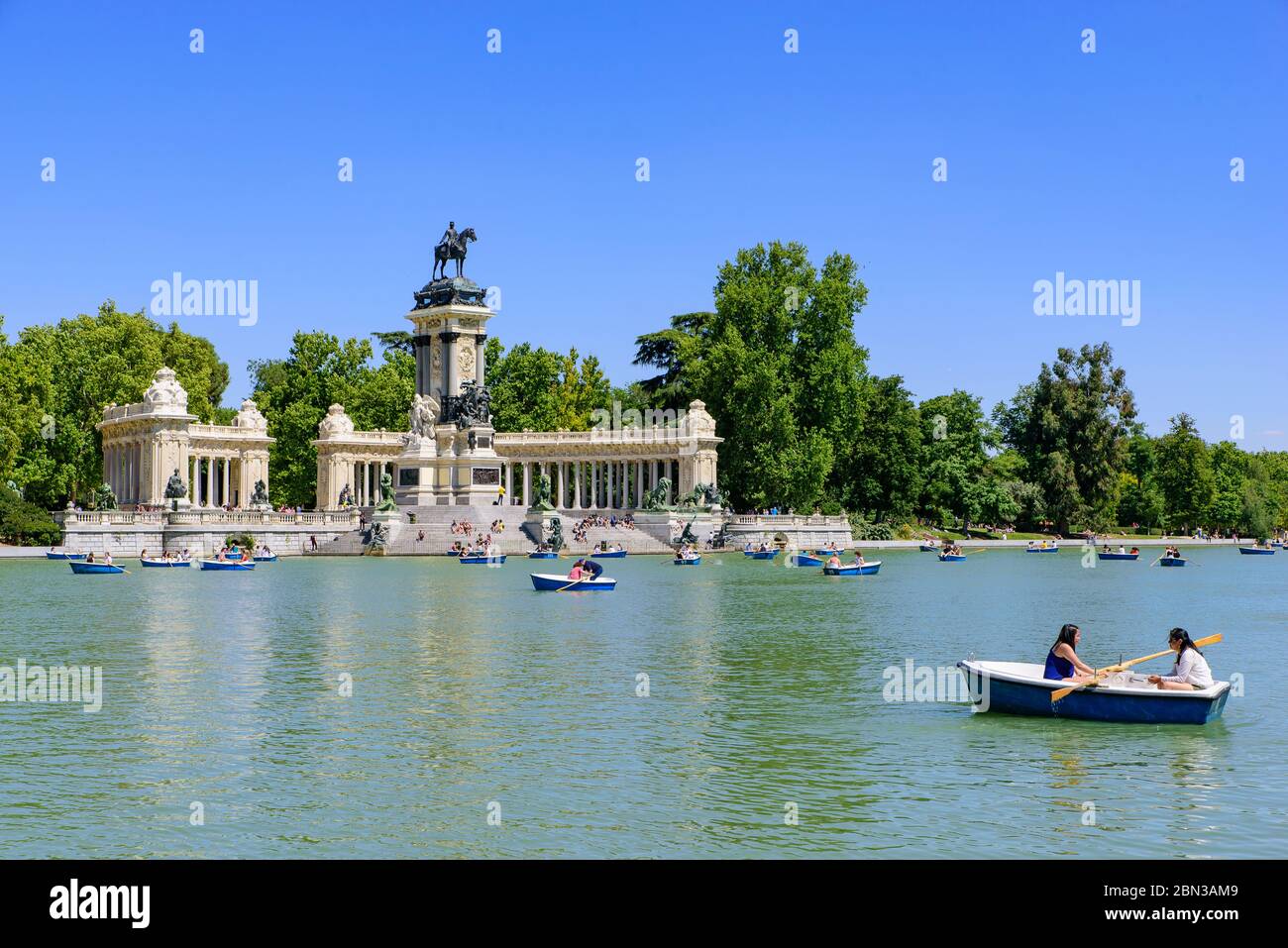 People rowing boats on the Retiro Park Lake in Madrid, Spain Stock ...