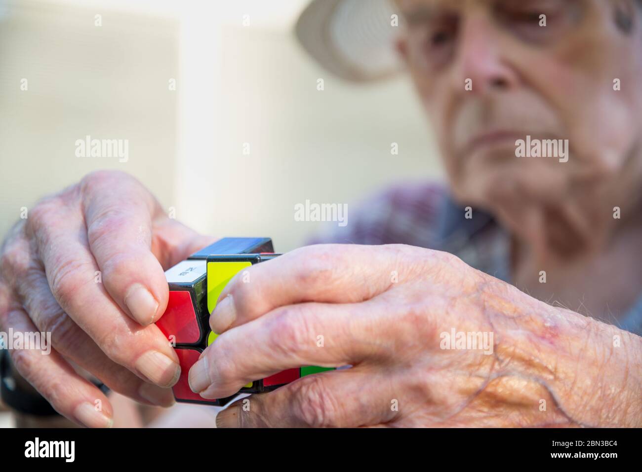Elderly man uses a Rubix cube puzzle as therapy for his diminished ...