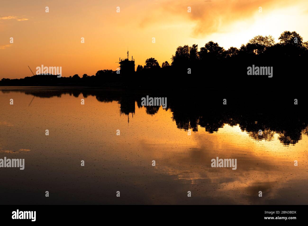 Sunset on the lake at Golden Hour Stock Photo - Alamy