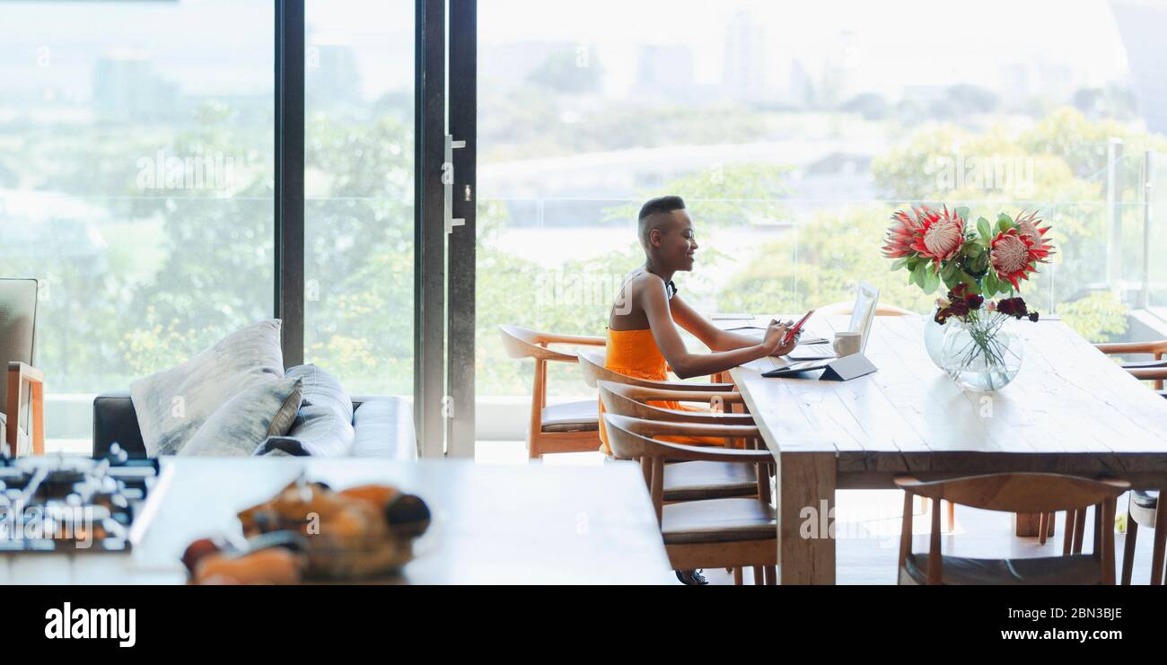 Working at the dining table hi-res stock photography and images - Alamy