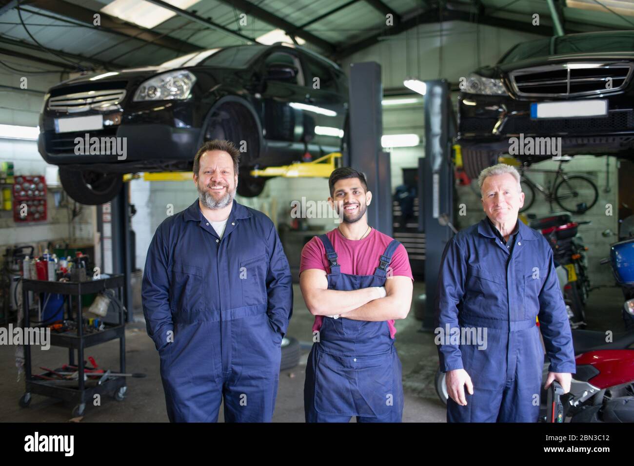 Portrait confident male mechanics in auto repair shop Stock Photo - Alamy