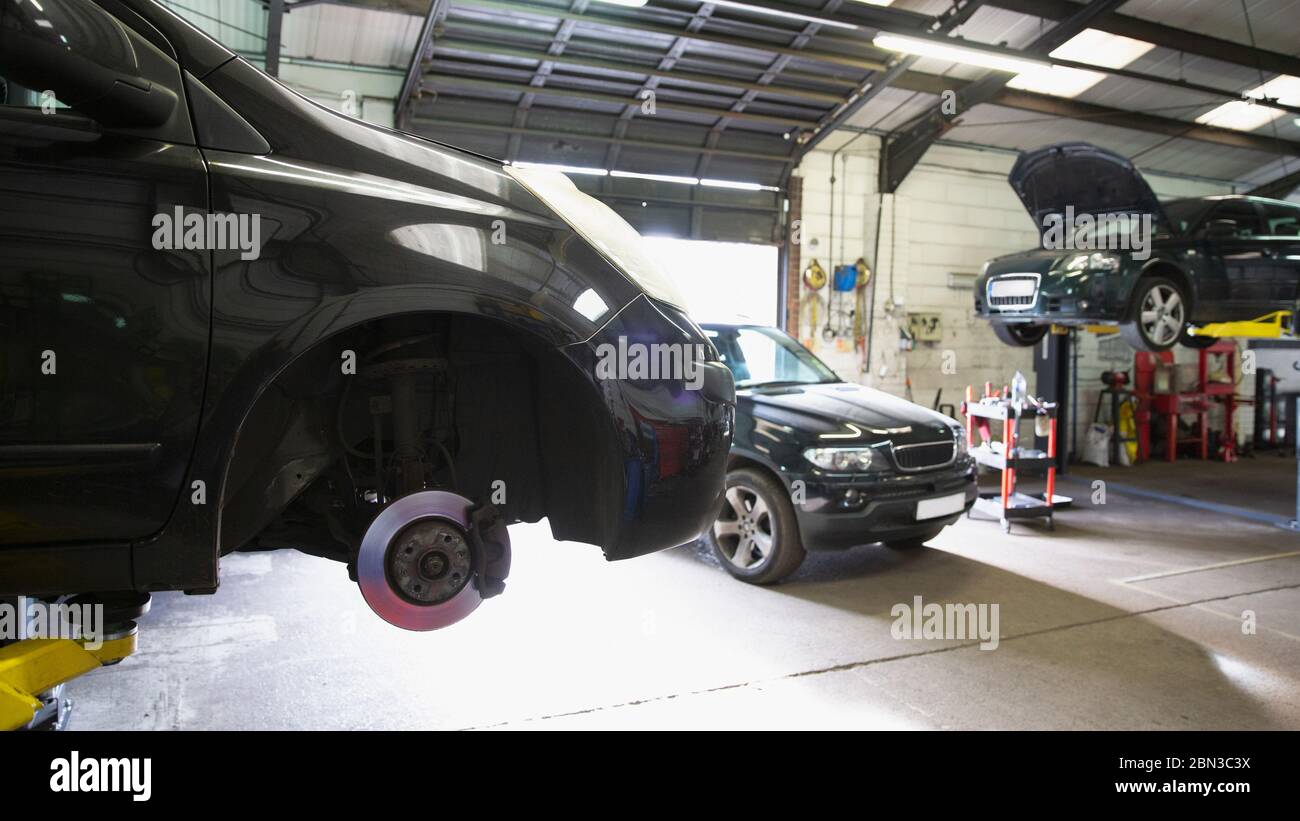 Cars in auto repair shop Stock Photo - Alamy