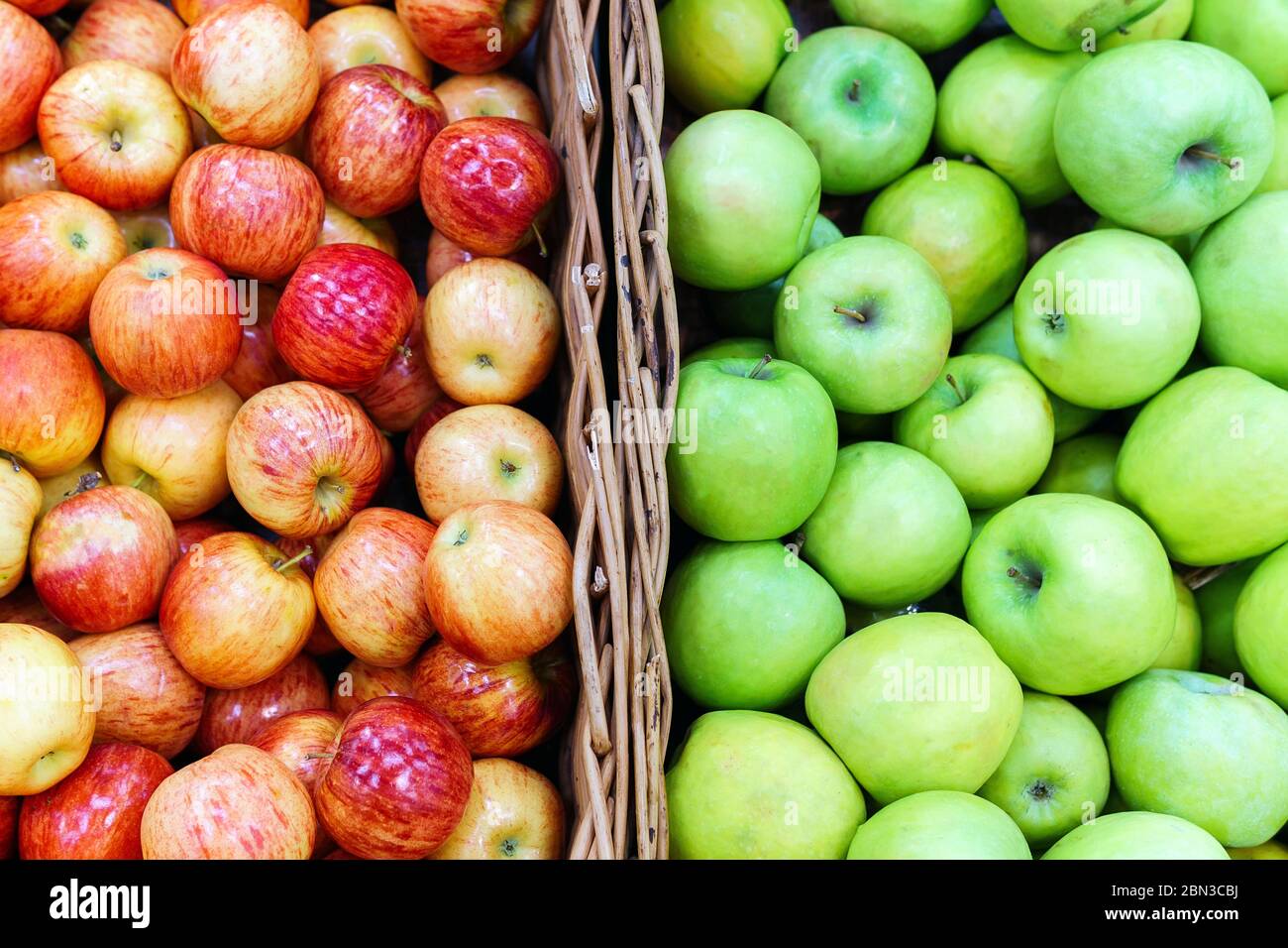 Variety of colorful fresh fruits red apple, green apple on the local ...