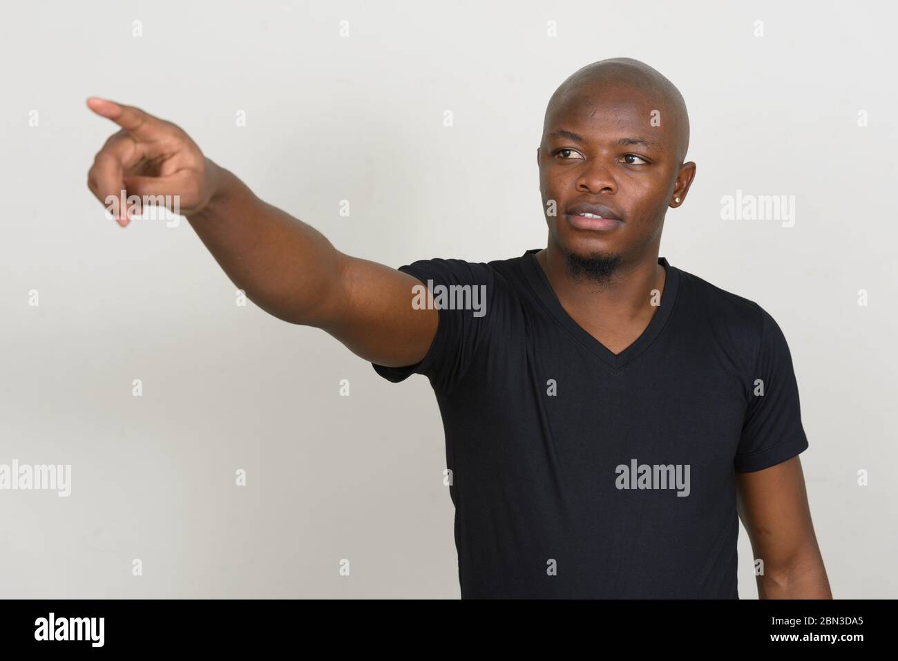 Happy young handsome bald African man pointing finger Stock Photo - Alamy