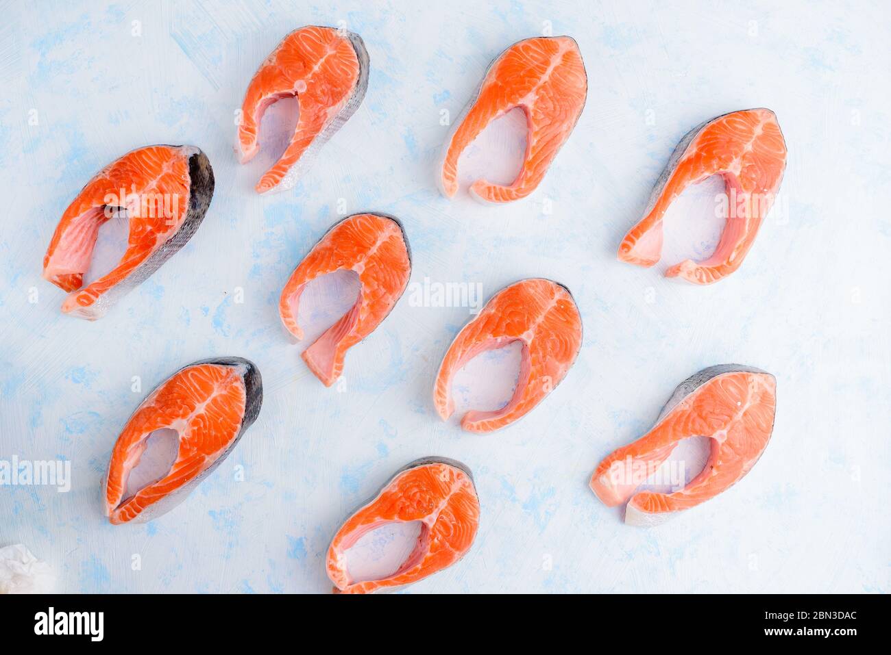 fresh uncooked red fish fillet over white Stock Photo - Alamy
