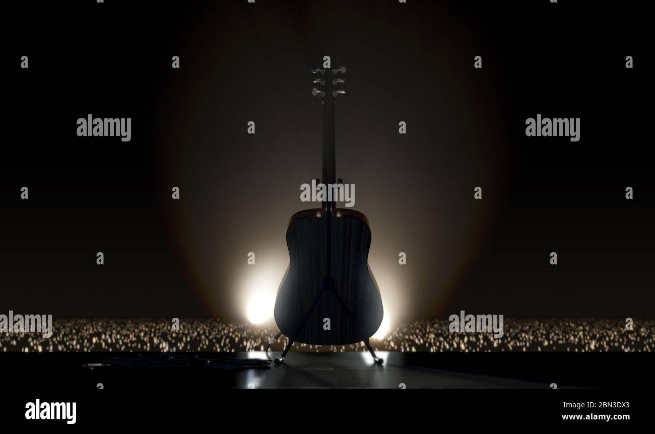 An acoustic guitar resting on a stand on a music concert stage lit by a ...