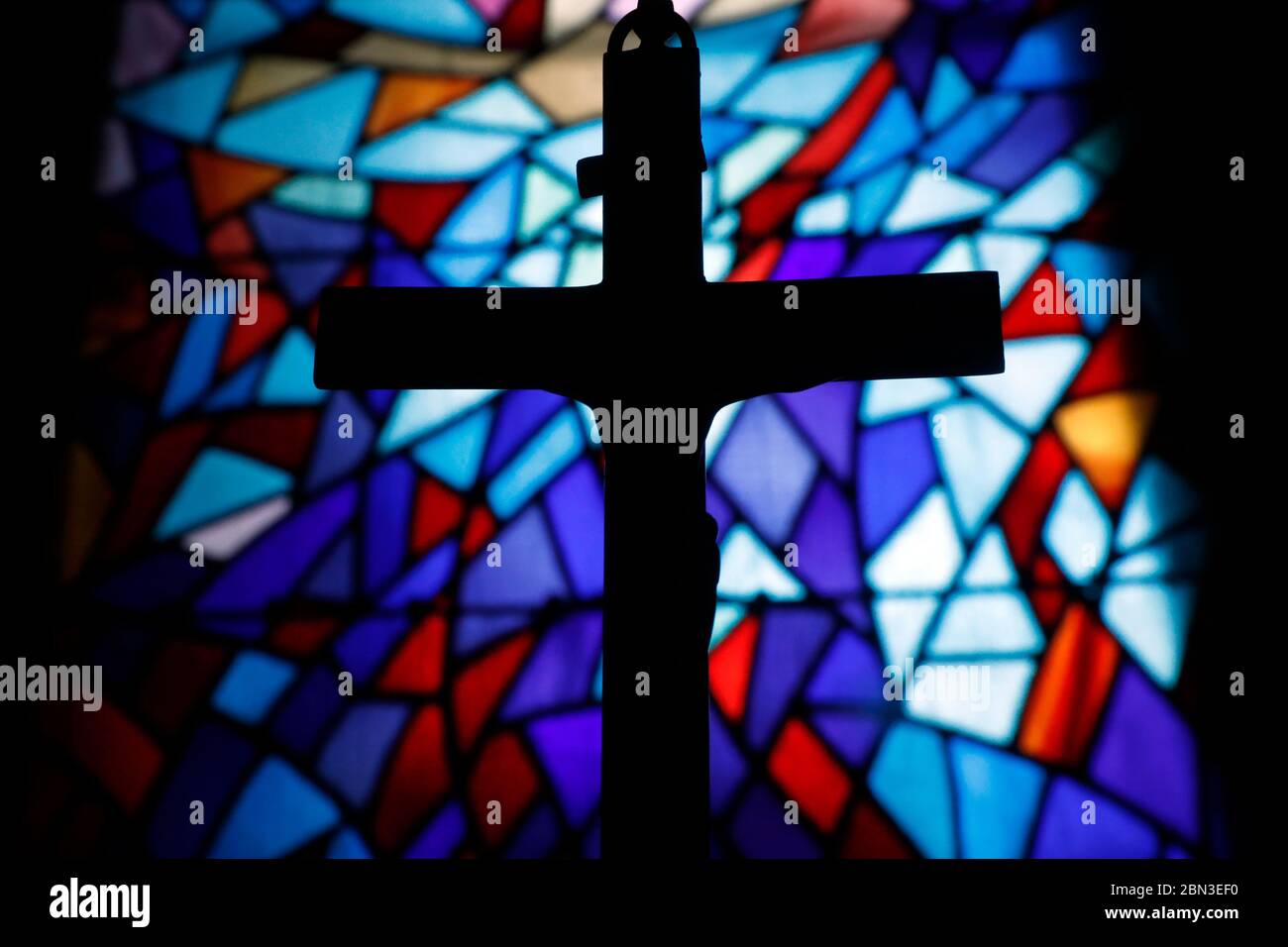 Cross against stained glass window. France Stock Photo - Alamy