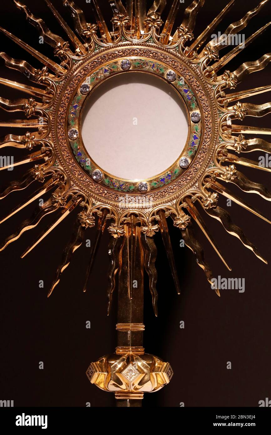 The Blessed Sacrament in a monstrance. Eucharist adoration. Paray le ...