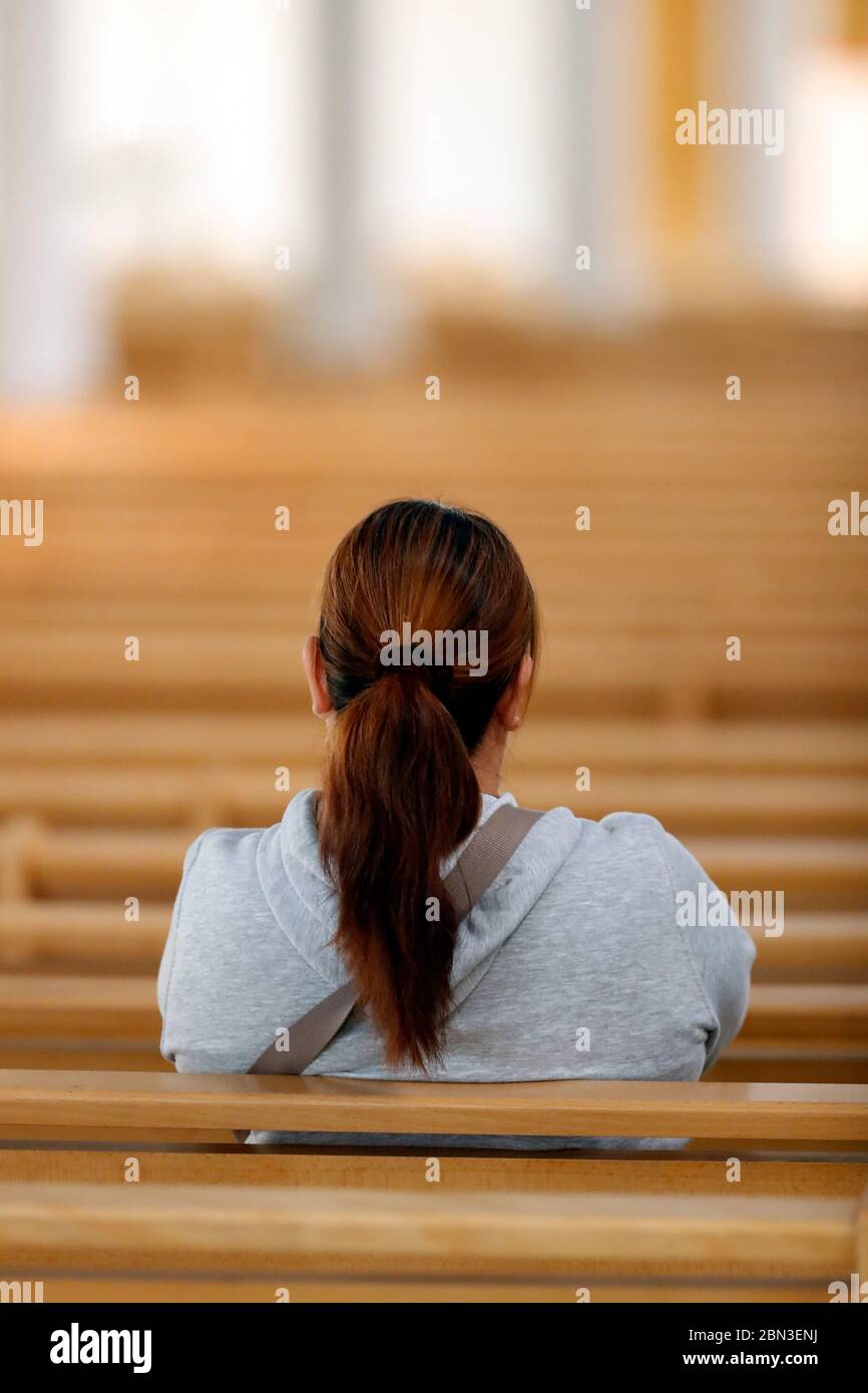 Woman praying alone in a church. Paris. France Stock Photo - Alamy