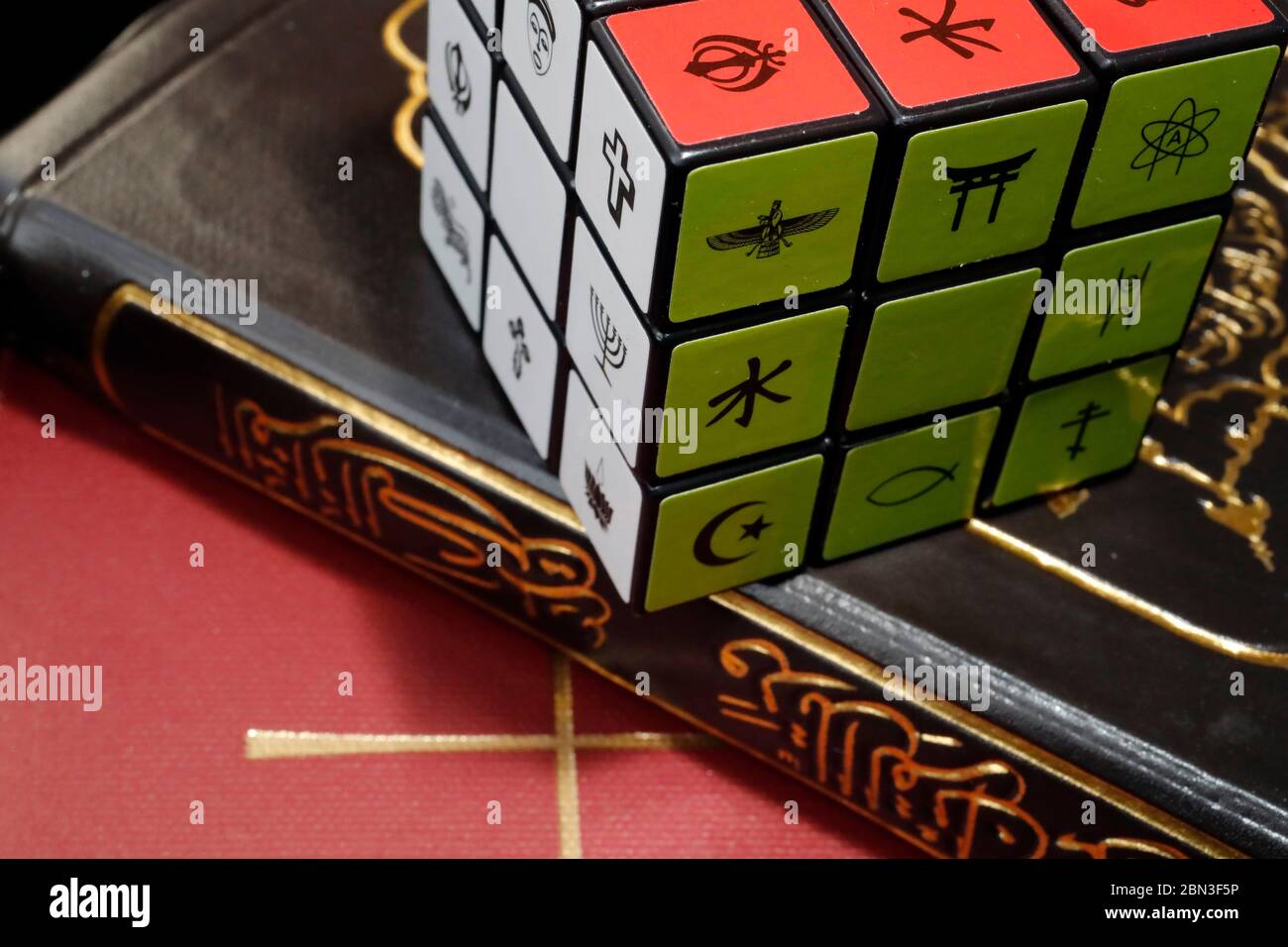 Quran, Bible and Rubik's cube with religious symbols. Interreligious ...