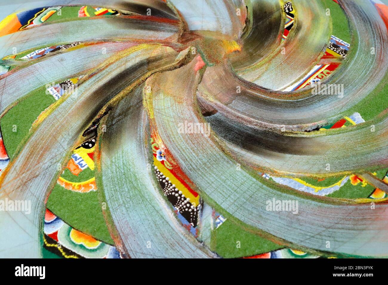 Tibetan Buddhist sand mandala. Bodhisattva Vajrasattva. A Tibetan monk ...