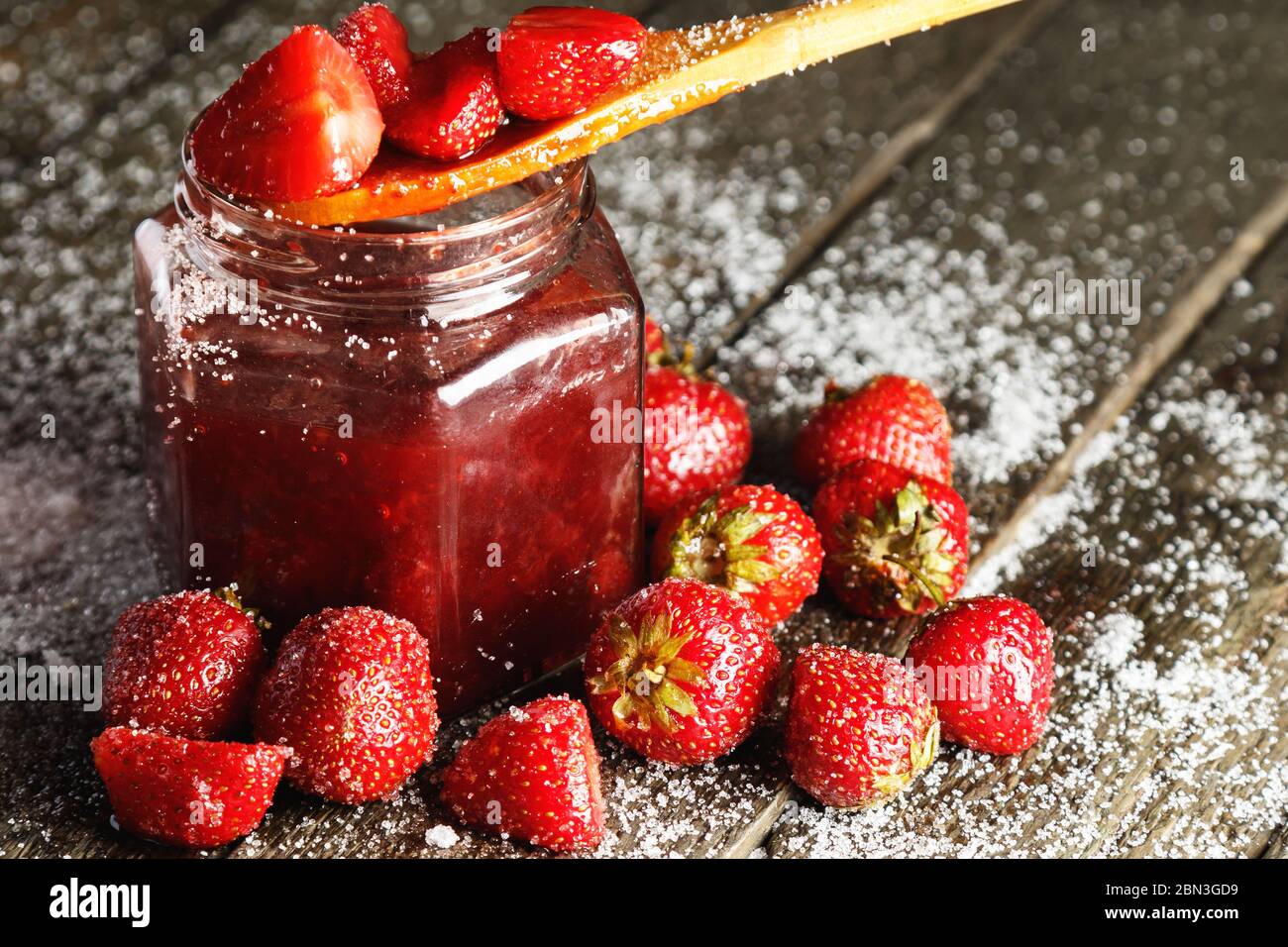 Homemade strawberry jam on wooden table Stock Photo - Alamy