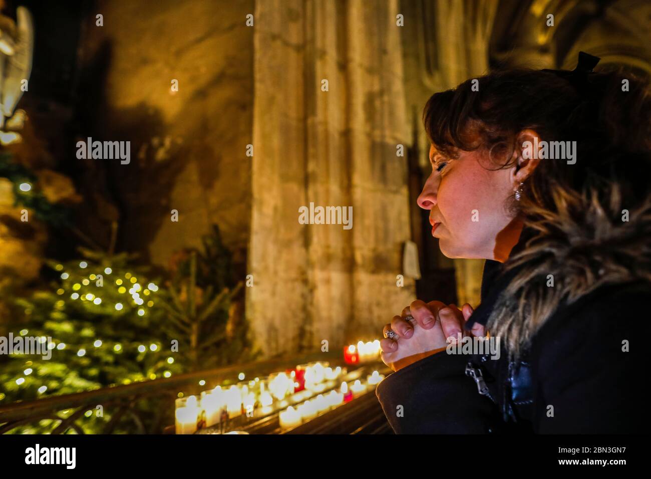 Catholic convert praying in a church in Paris, France Stock Photo - Alamy