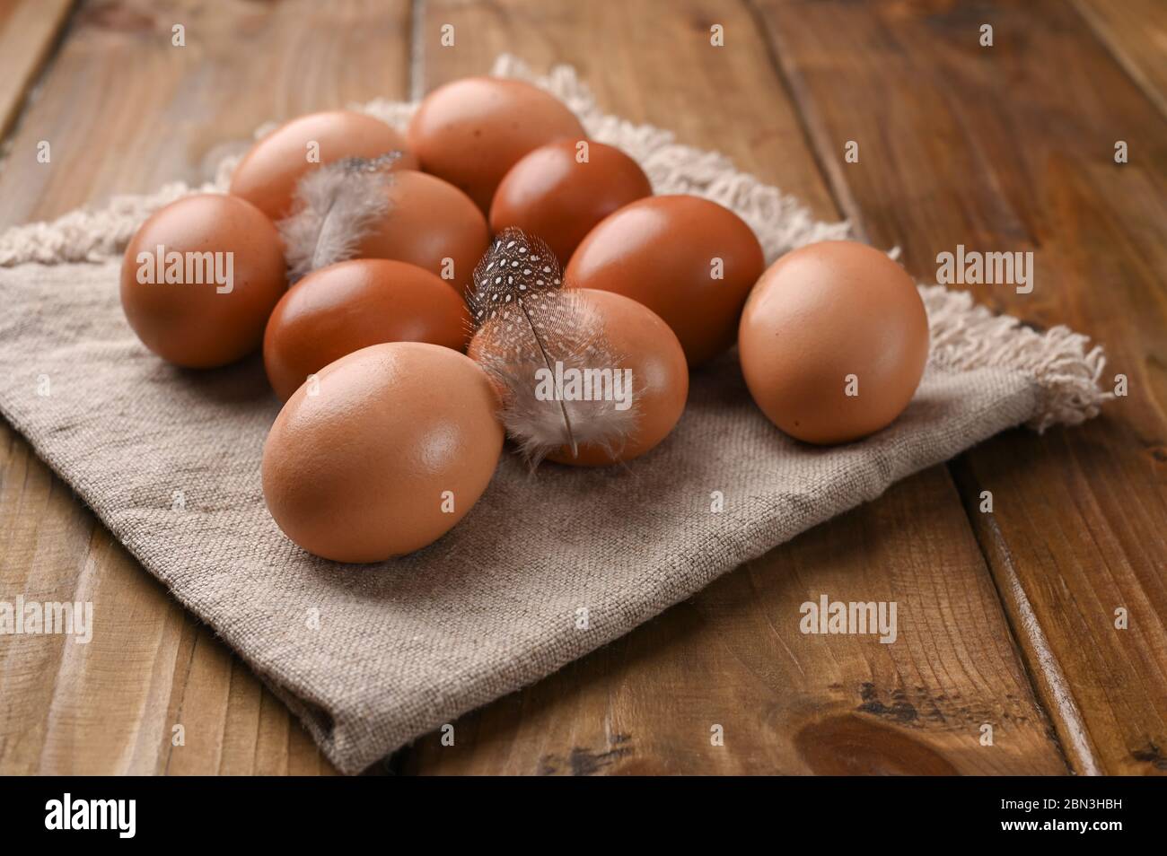 rustic eggs, from homemade chickens, on a wooden background, with ...
