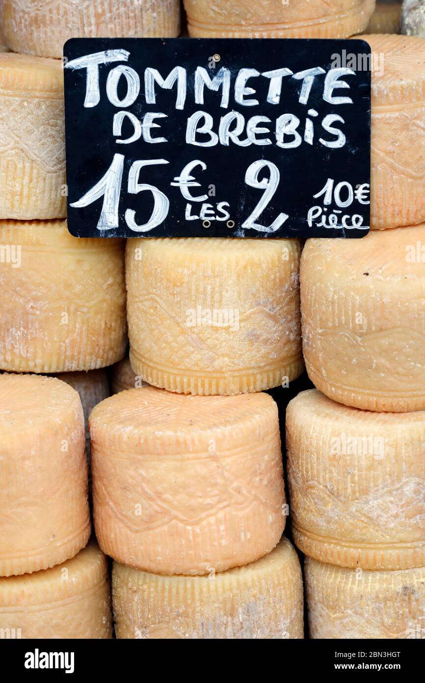 Traditional french cheese for sale at market. Tomme. France Stock Photo ...