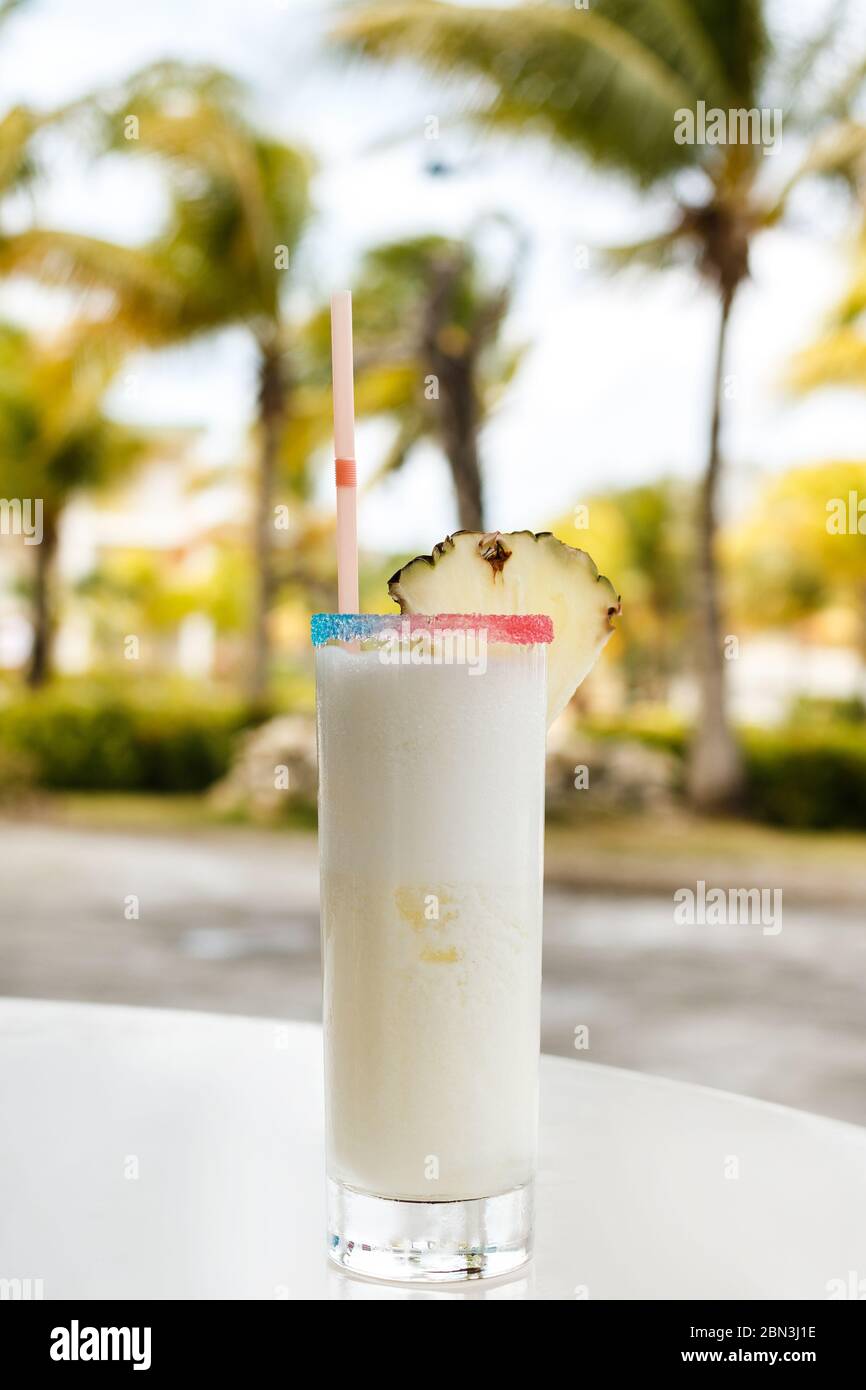 Glass of Pina colada cocktail on the table Stock Photo - Alamy