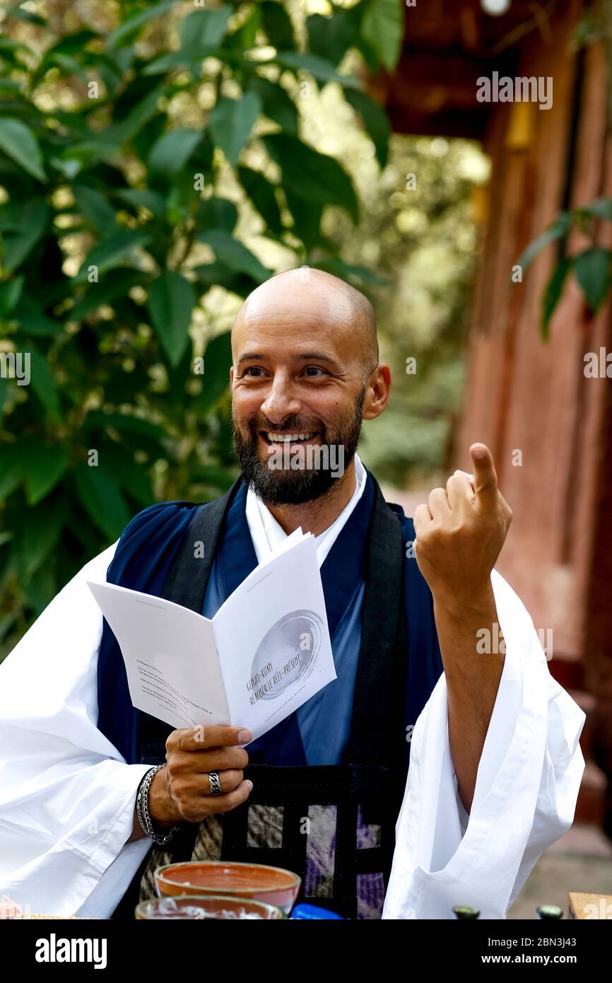 Zen master talking to disciples in Morocco Stock Photo - Alamy