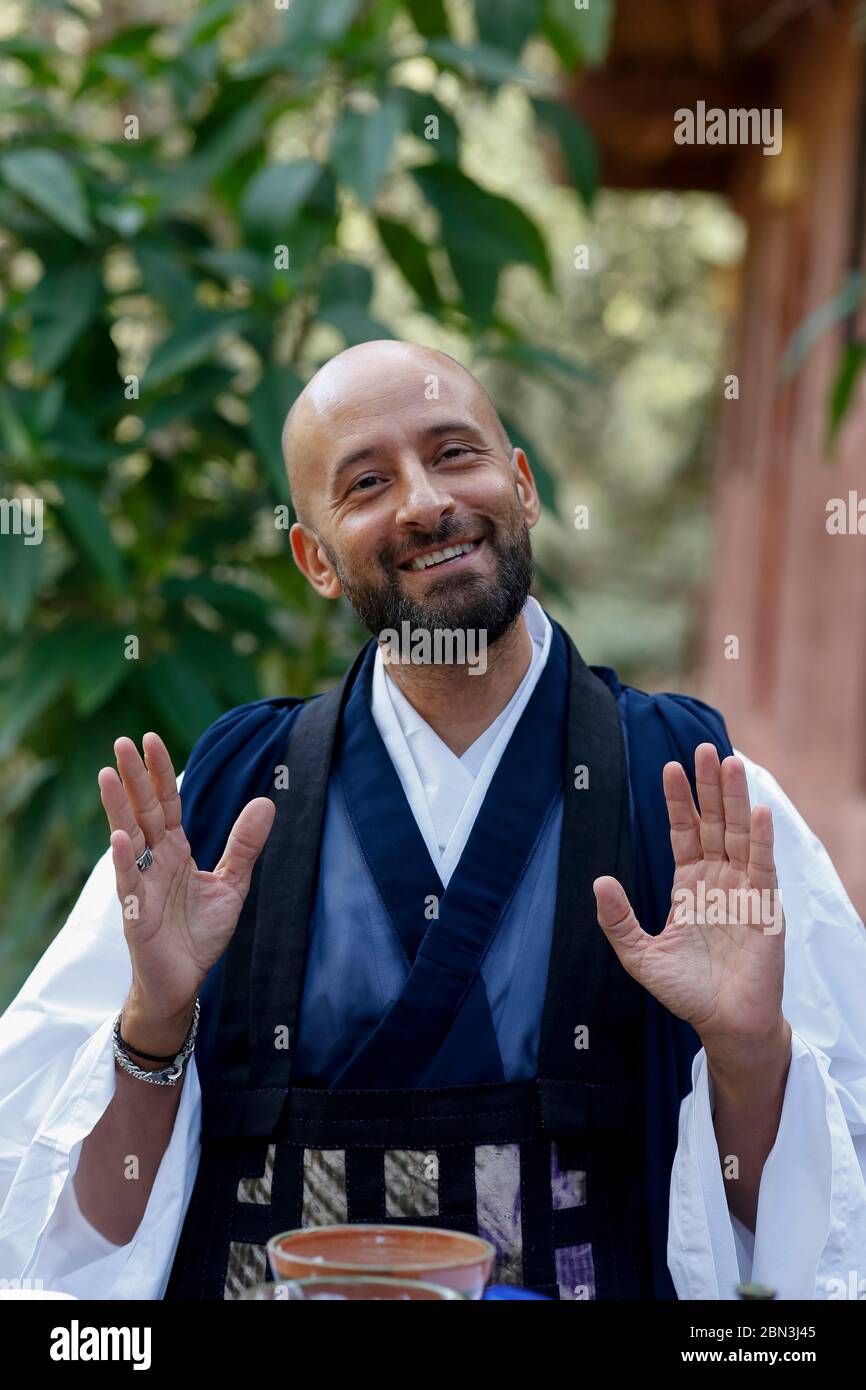 Zen master talking to disciples in Morocco Stock Photo - Alamy