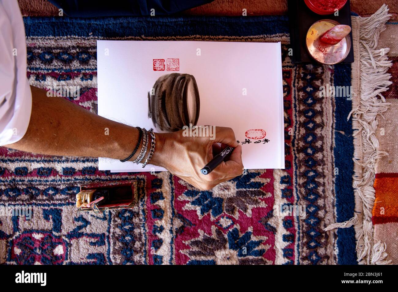 Zen sesshin (retreat) in the Sahara desert, Morocco. Calligraphy ...