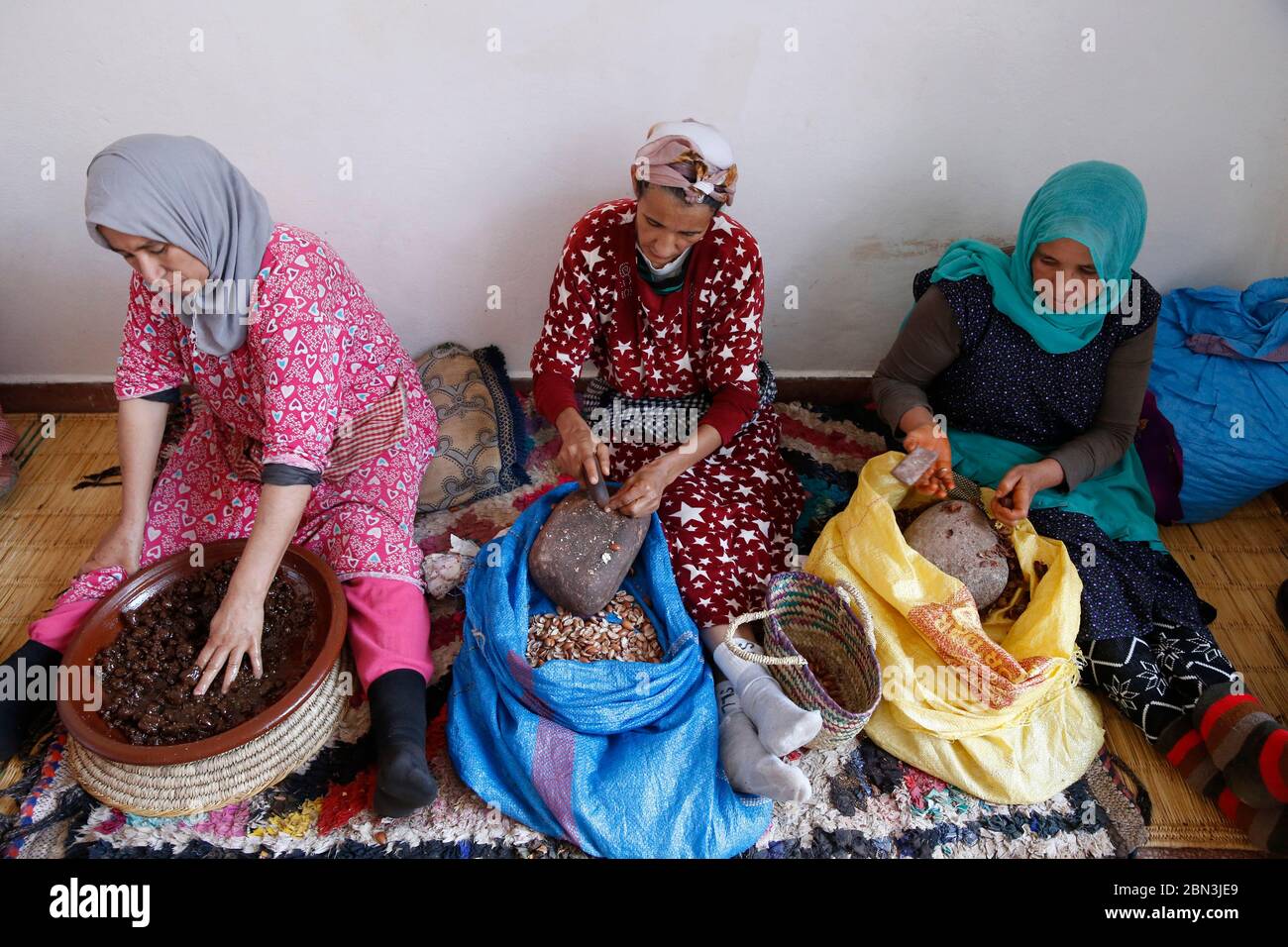 Women making argan oil in Ourika valley, Morocco Stock Photo - Alamy