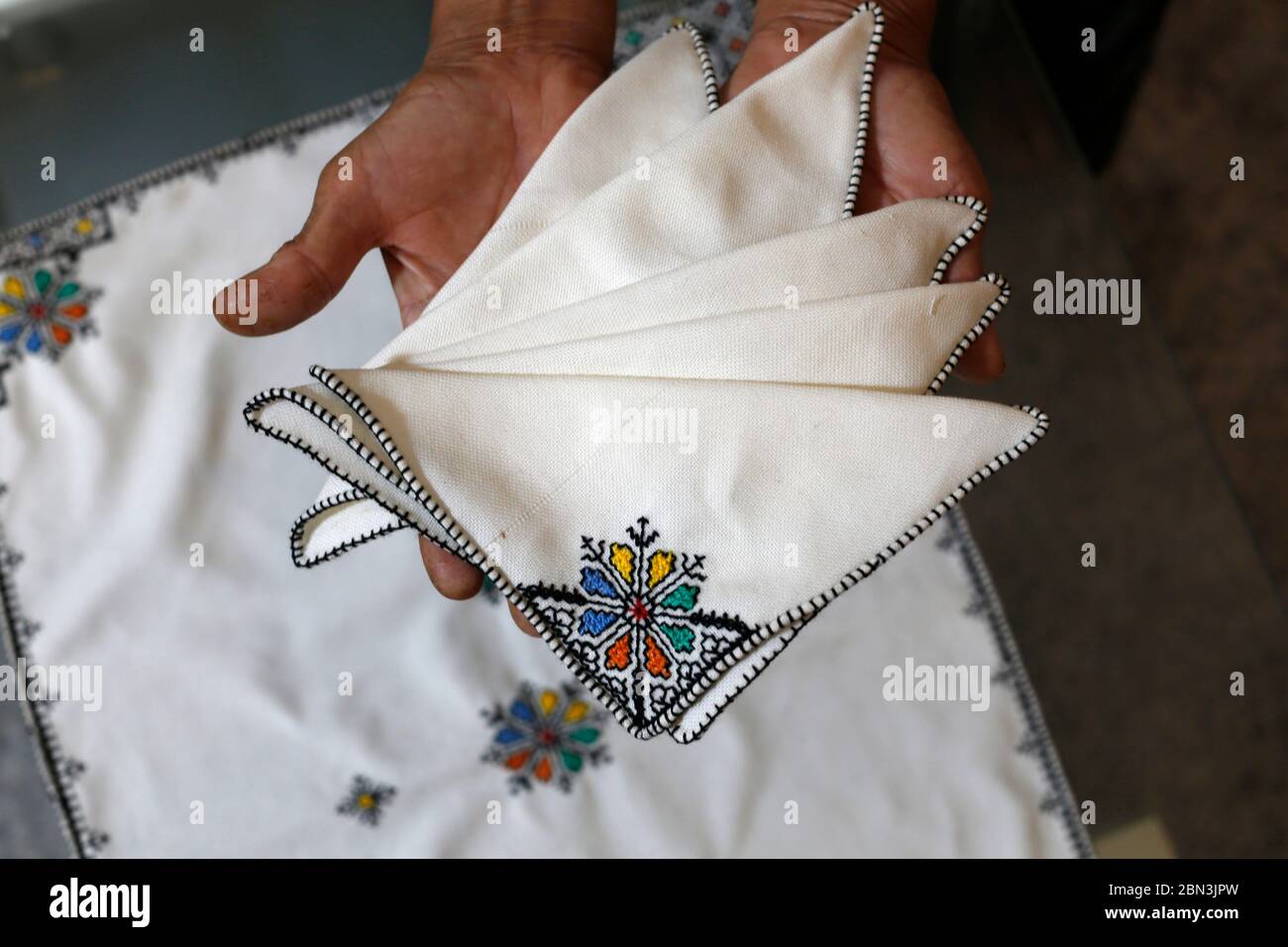 Woman showing traditional embroidery in Meknes, Morocco Stock Photo - Alamy